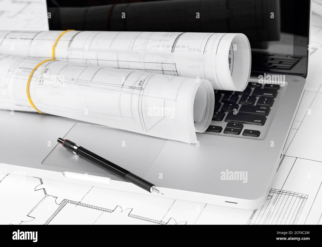 Blueprints and laptop Stock Photo - Alamy