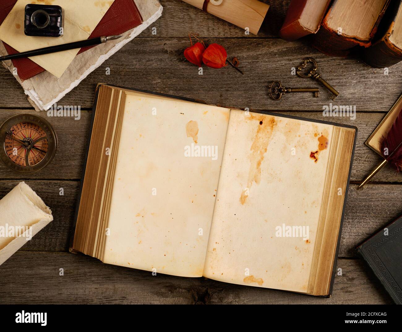 Blank antique book open on a table Stock Photo - Alamy