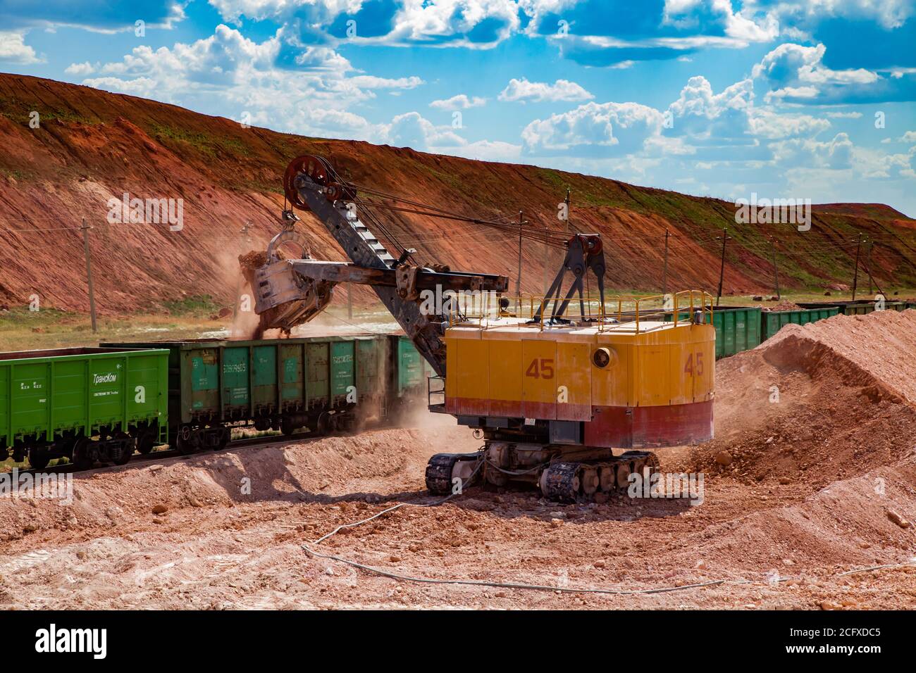 Aluminium ore mining and transporting. Bauxite clay Open-cut mining ...