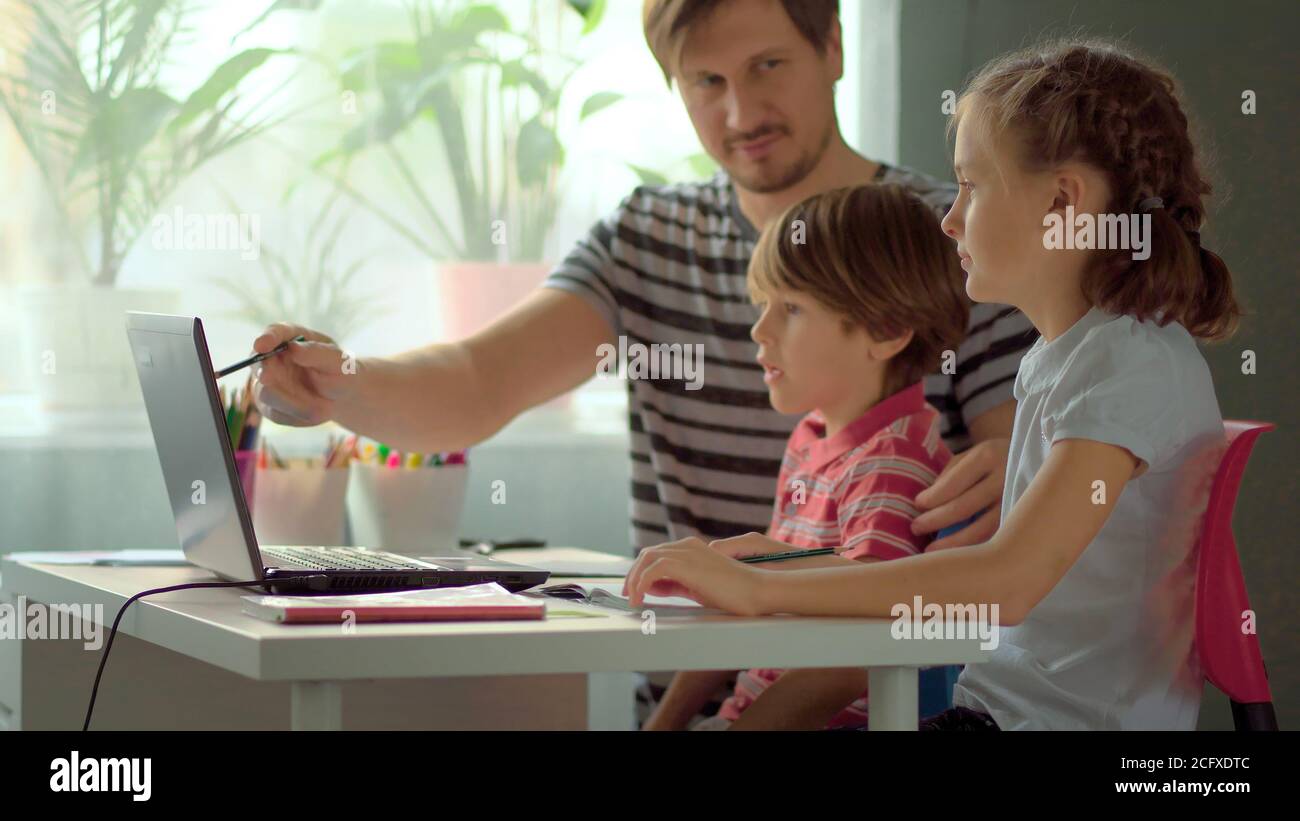 Cute children use laptop for education, online study, home studying ...