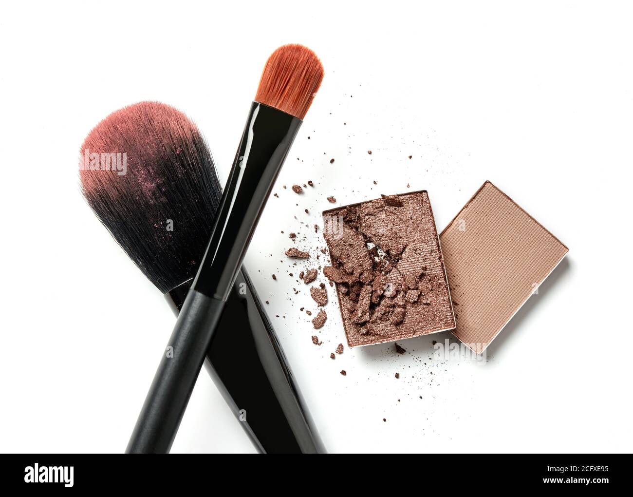 Brown face powders and makeup brush on white background Stock Photo - Alamy