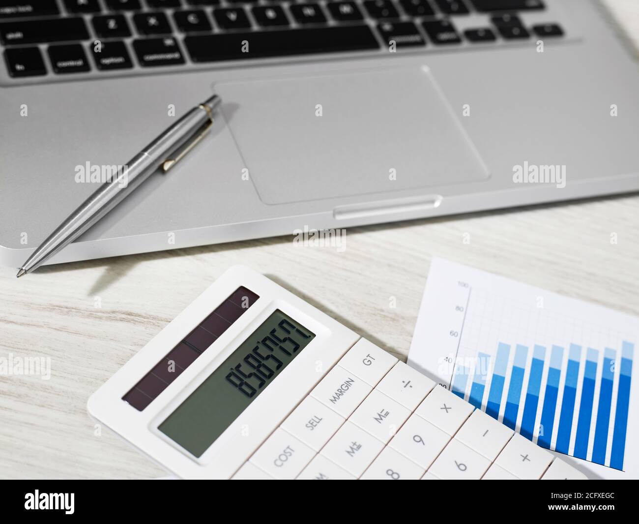 Calculator, laptop and financial papers Stock Photo - Alamy