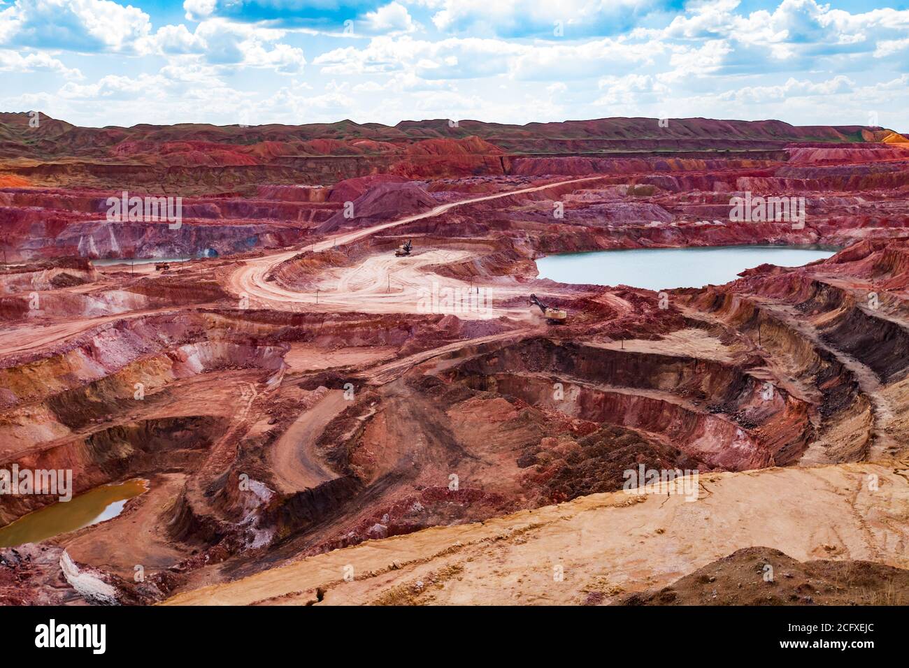 Aluminium ore quarry. Blue quarry lake in bauxite mine. Open cast (open ...