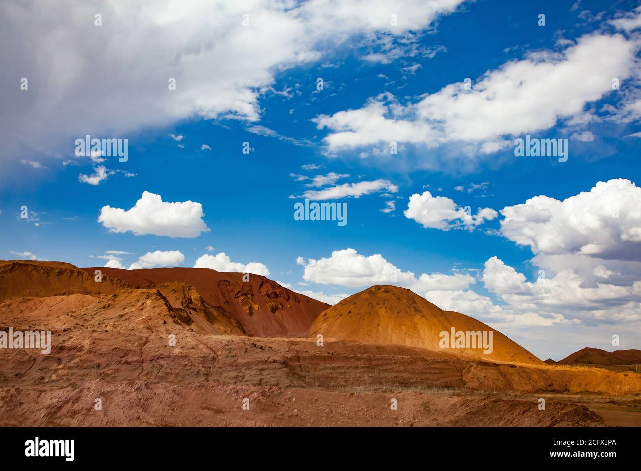 Aluminium ore quarry. Bauxite open cast (open cut) mining. Big yellow ...