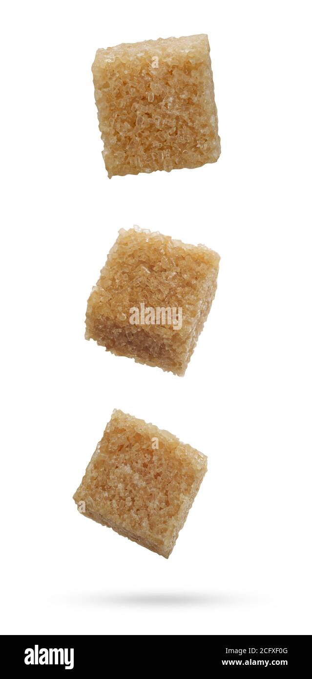 Brown sugar cubes falling, isolated on white Stock Photo - Alamy