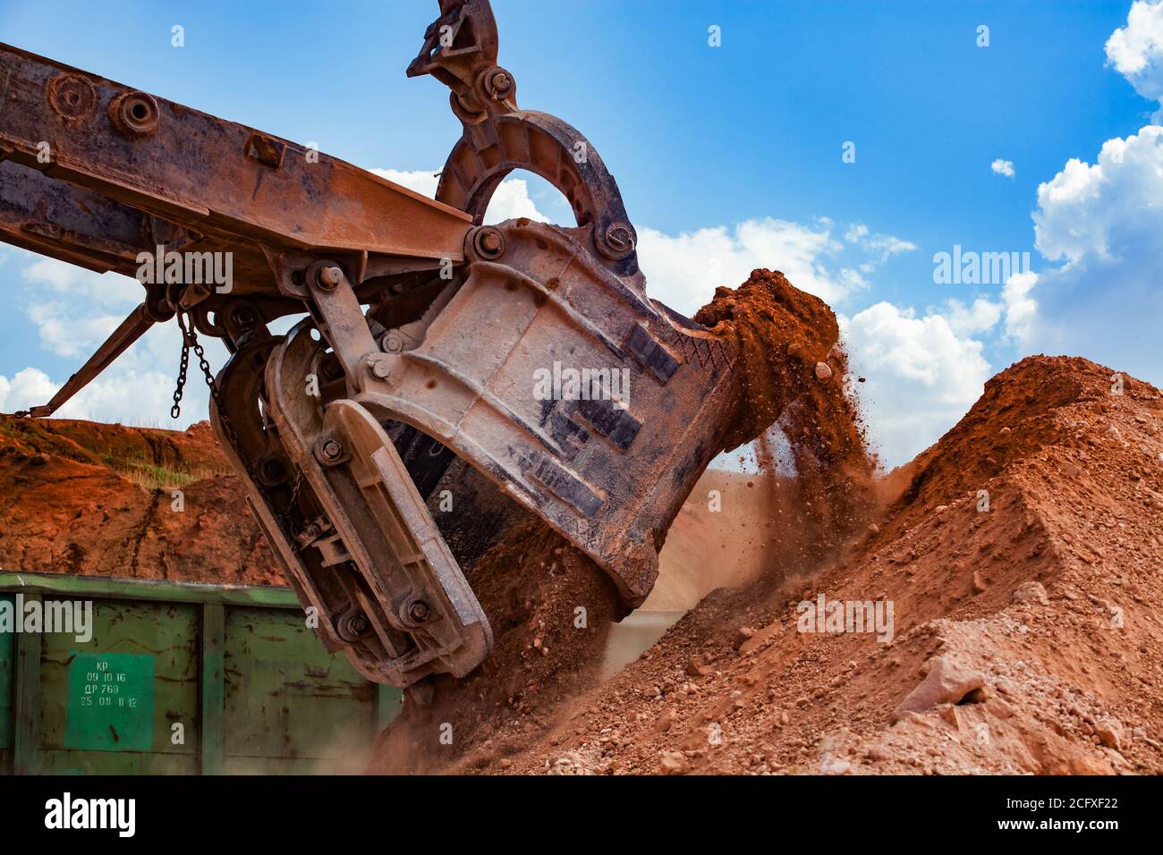 Aluminium ore quarry. Bauxite clay open-cut mining. Loading ore to ...