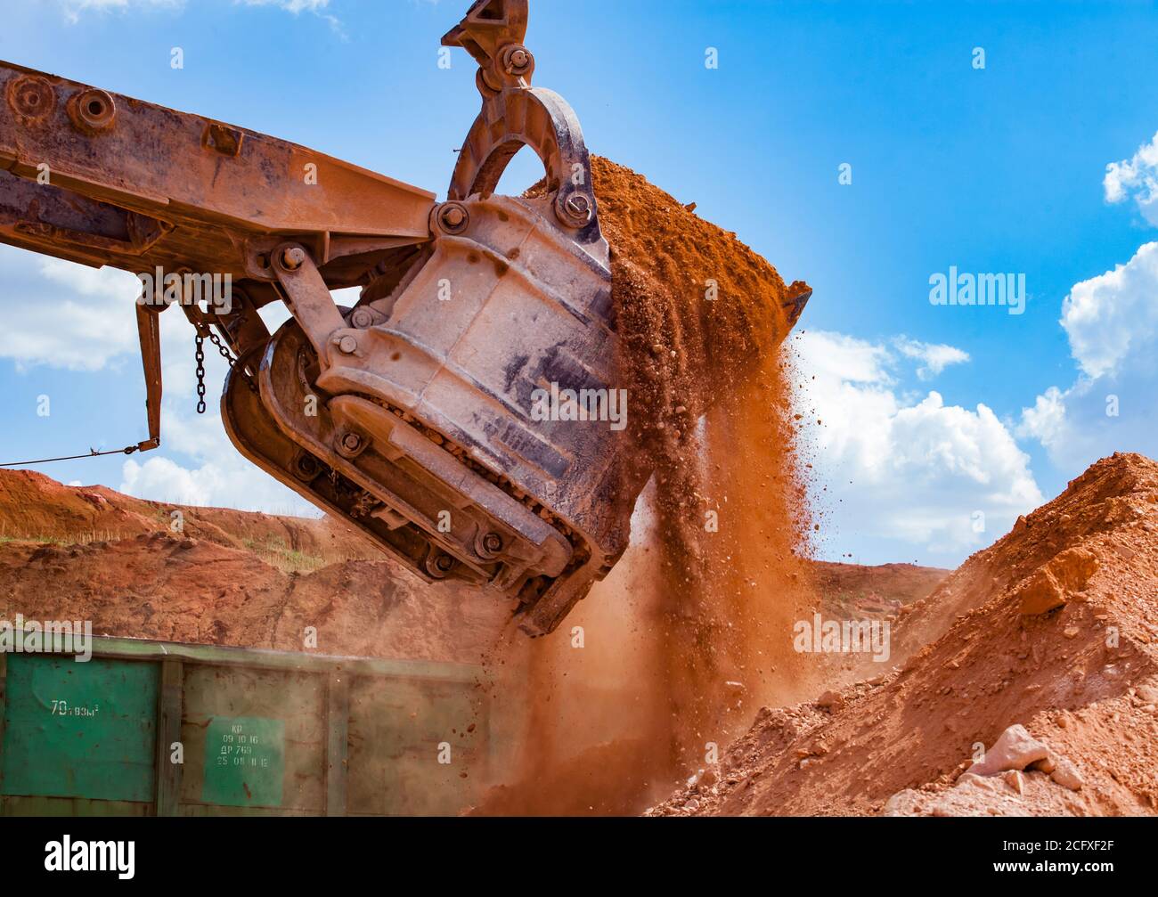 Aluminium ore quarry. Bauxite clay open-cut mining. Loading ore to ...