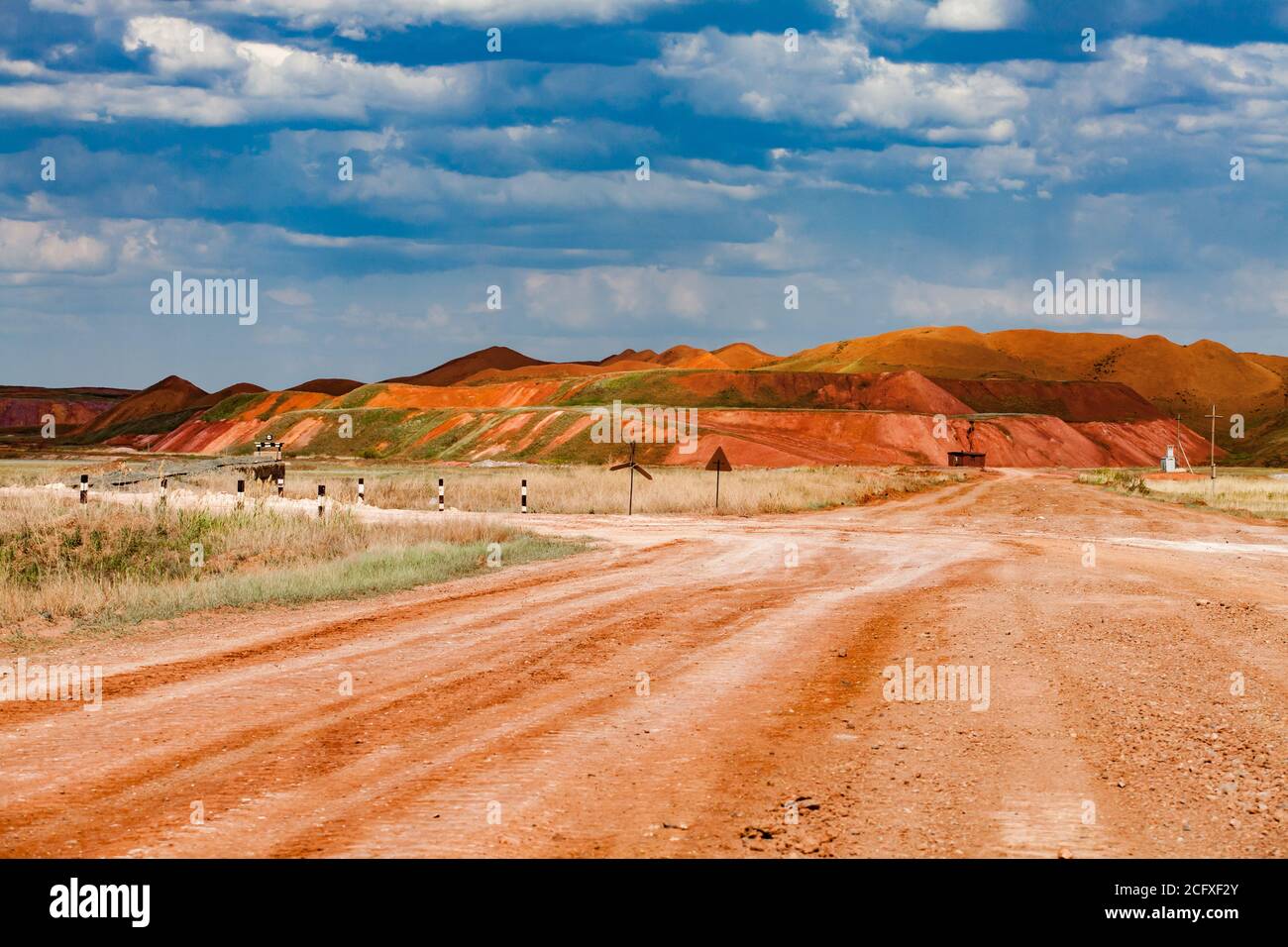 Landscape of bauxite mine (aluminium ore quarry). Orange clay soil and ...