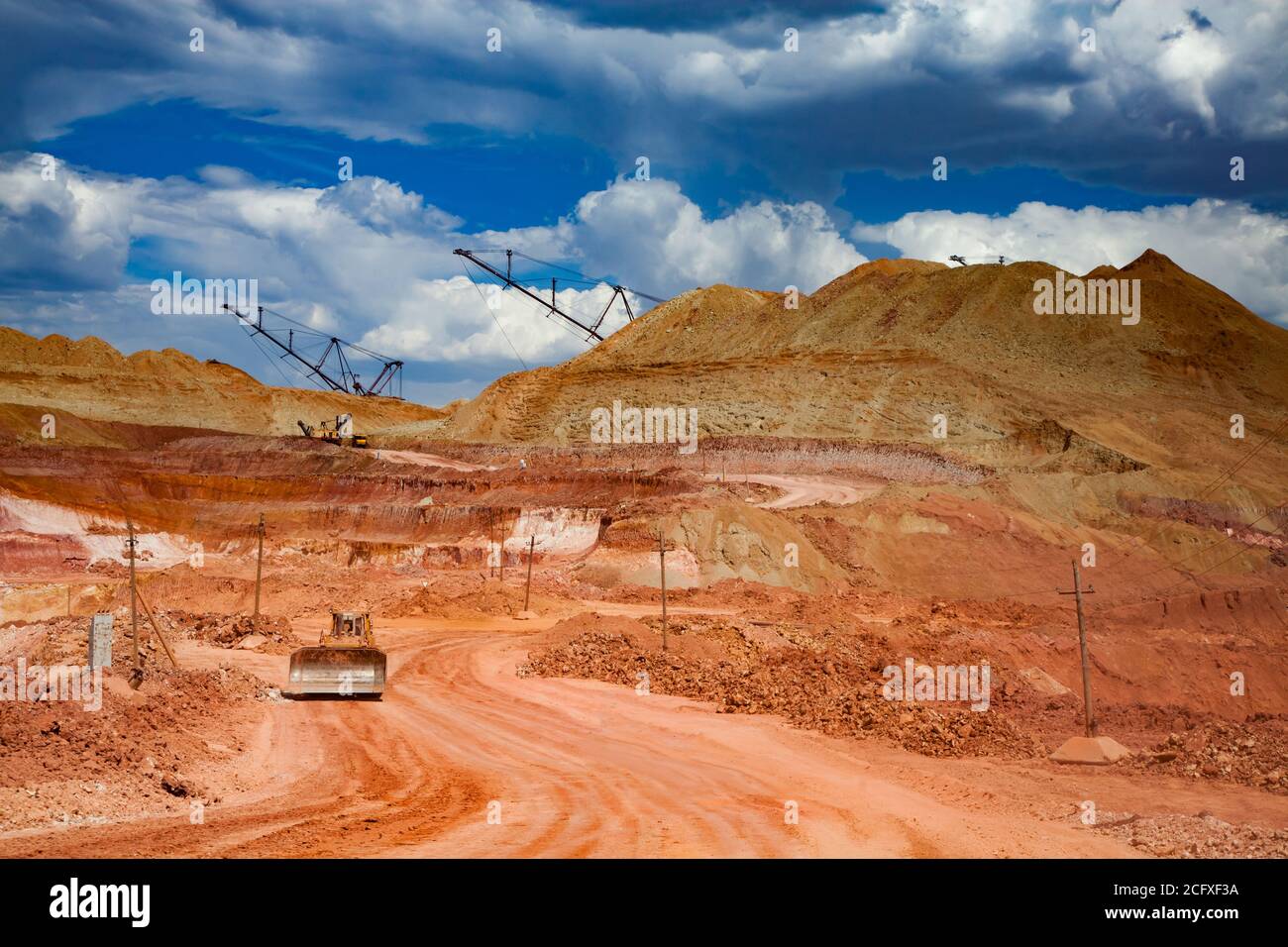 Aluminium ore quarry. Bauxite clay open-cut mining. Walking dragline ...