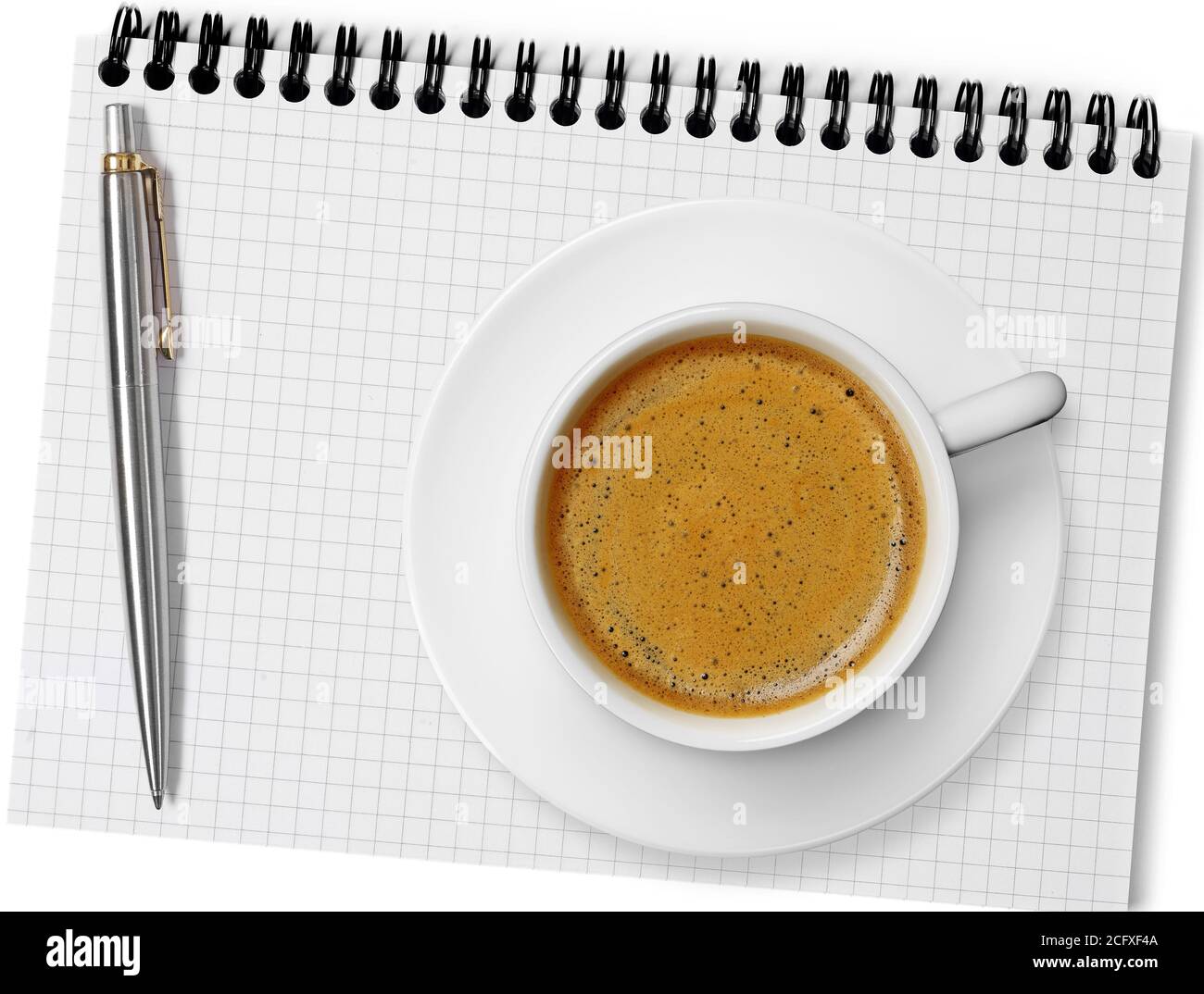 Coffee cup on notebook Stock Photo - Alamy