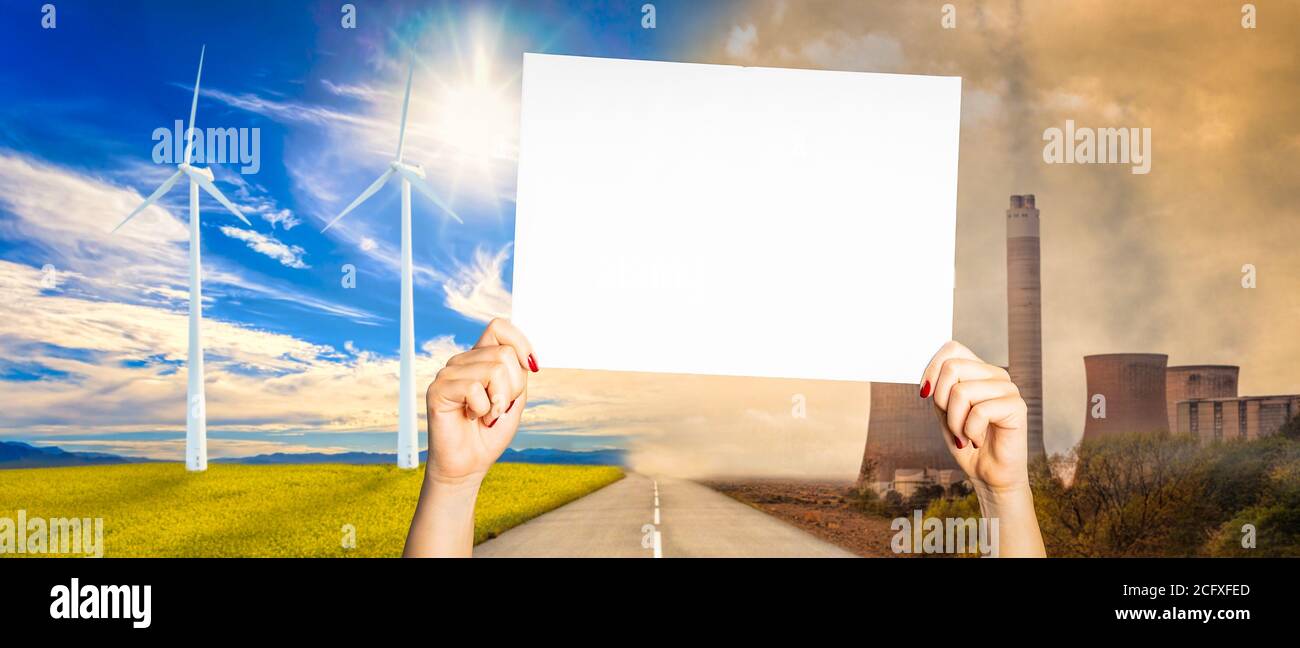a demonstrator holds up a sign to label the topic of environmental ...