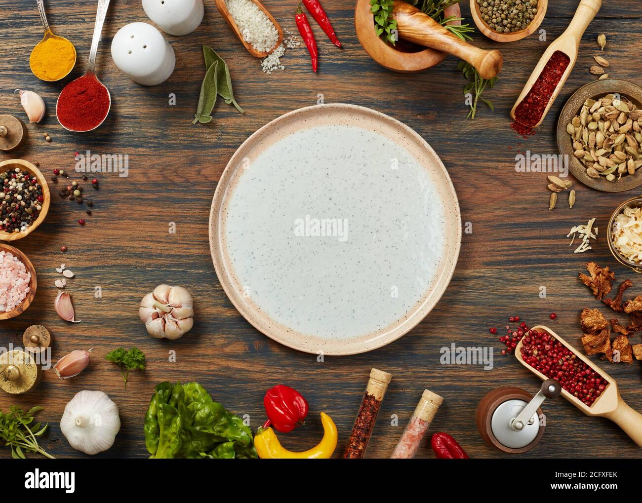 Cooking ingredients and plate on wood Stock Photo - Alamy
