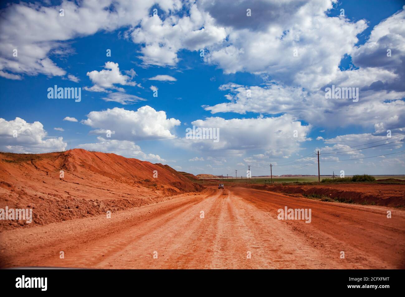 Bauxite clay open-cut mining. Red clay road in aluminium ore quarry ...