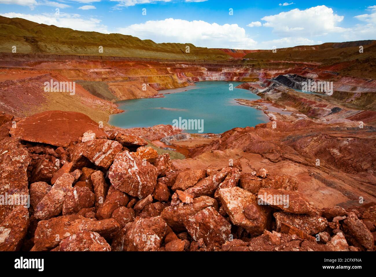 Aluminium ore quarry. Bauxite clay open-cut mining. Red stones, steps ...
