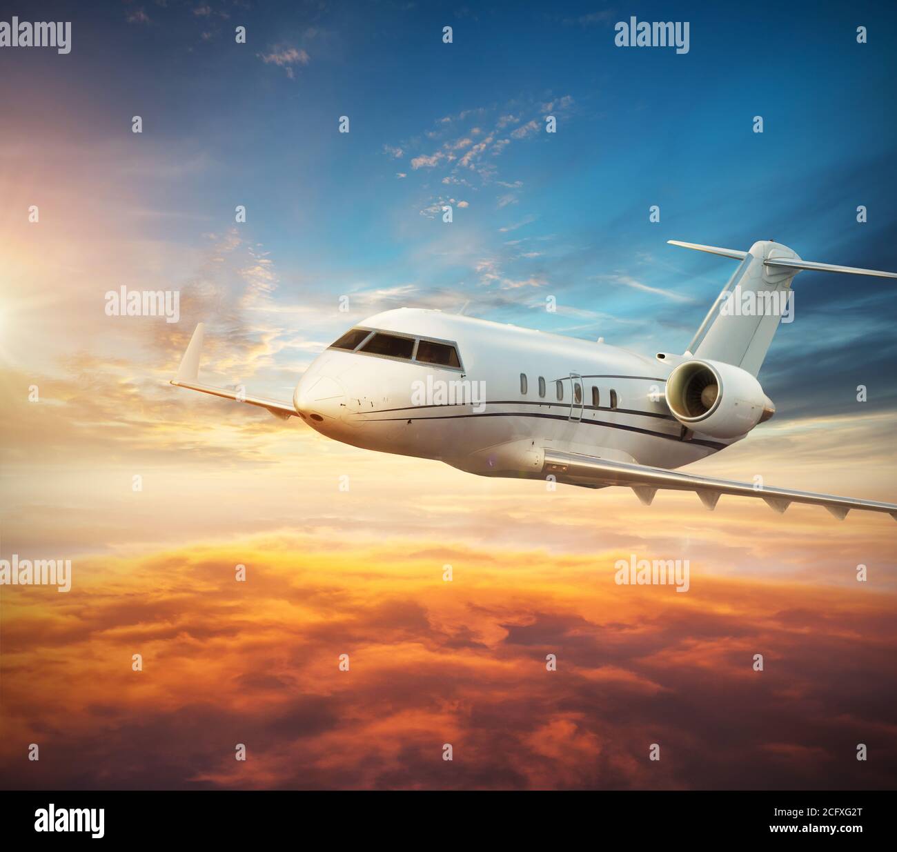 Luxury private jetliner flying above clouds. Modern and fastest mode of ...