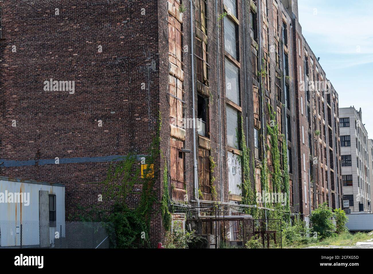 Abandoned dilapidated building standing in revitalizing area of ...