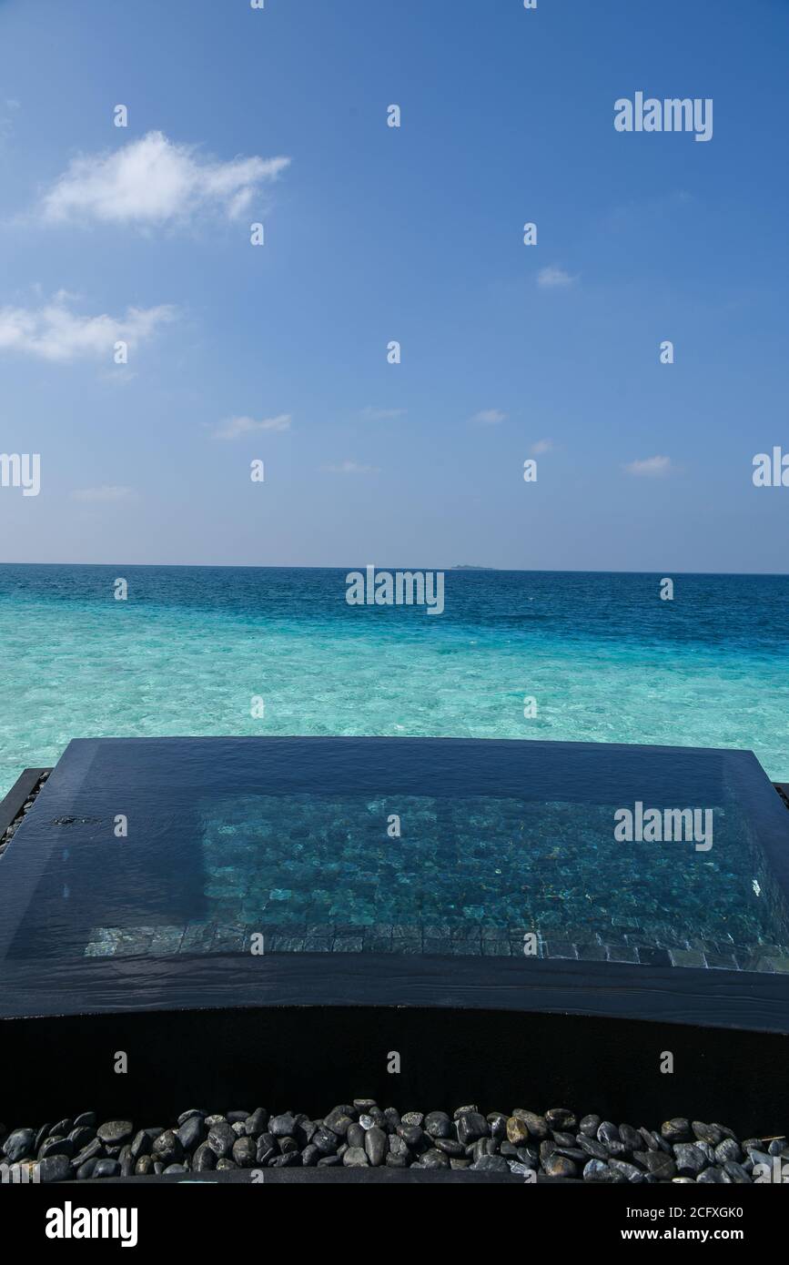 The infinity pool and terrace of a private villa at a luxury resort in ...
