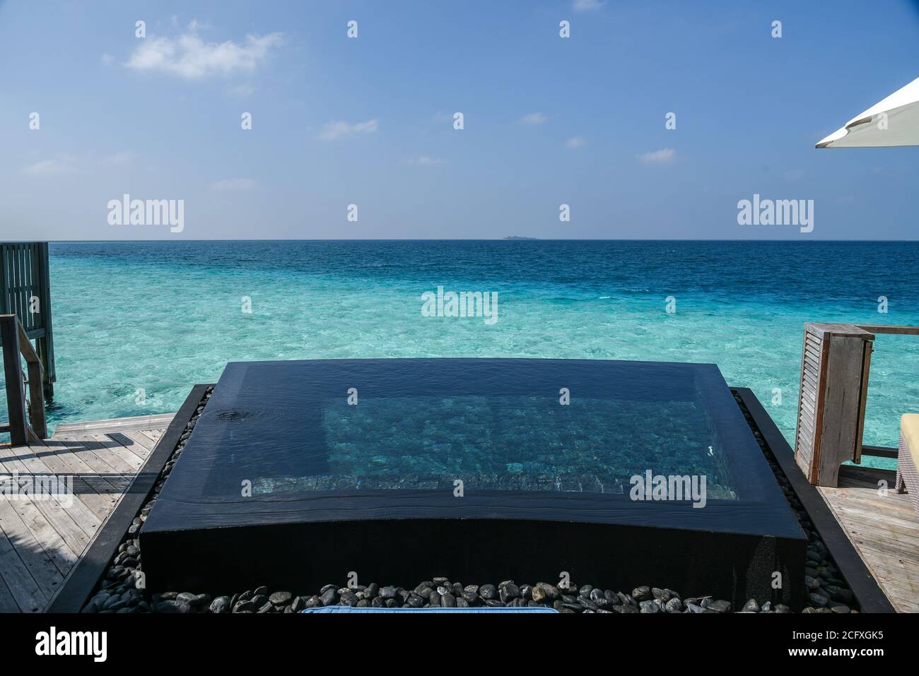 The infinity pool and terrace of a private villa at a luxury resort in ...