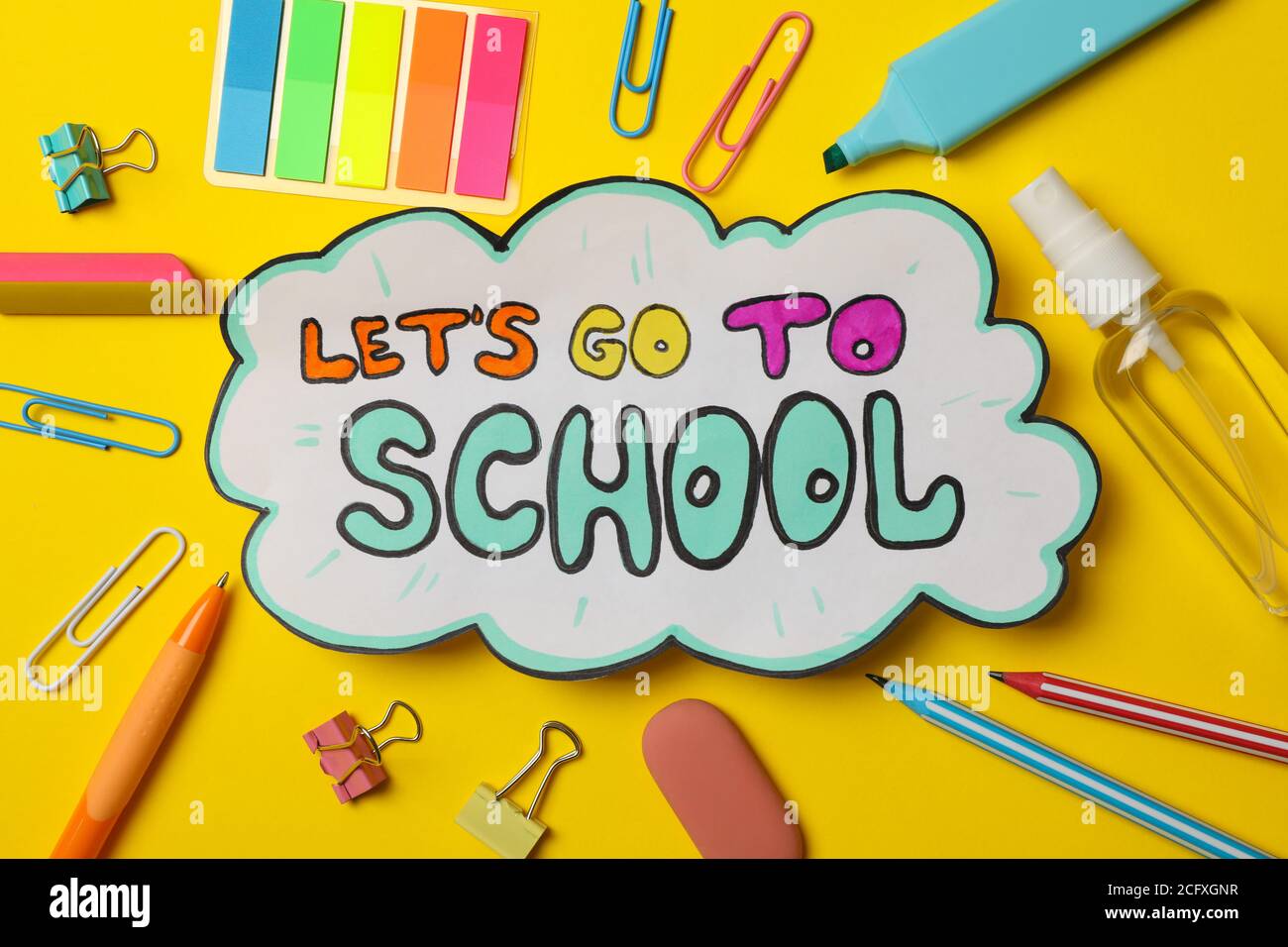 Text Let's go to school and school supplies on yellow background Stock ...