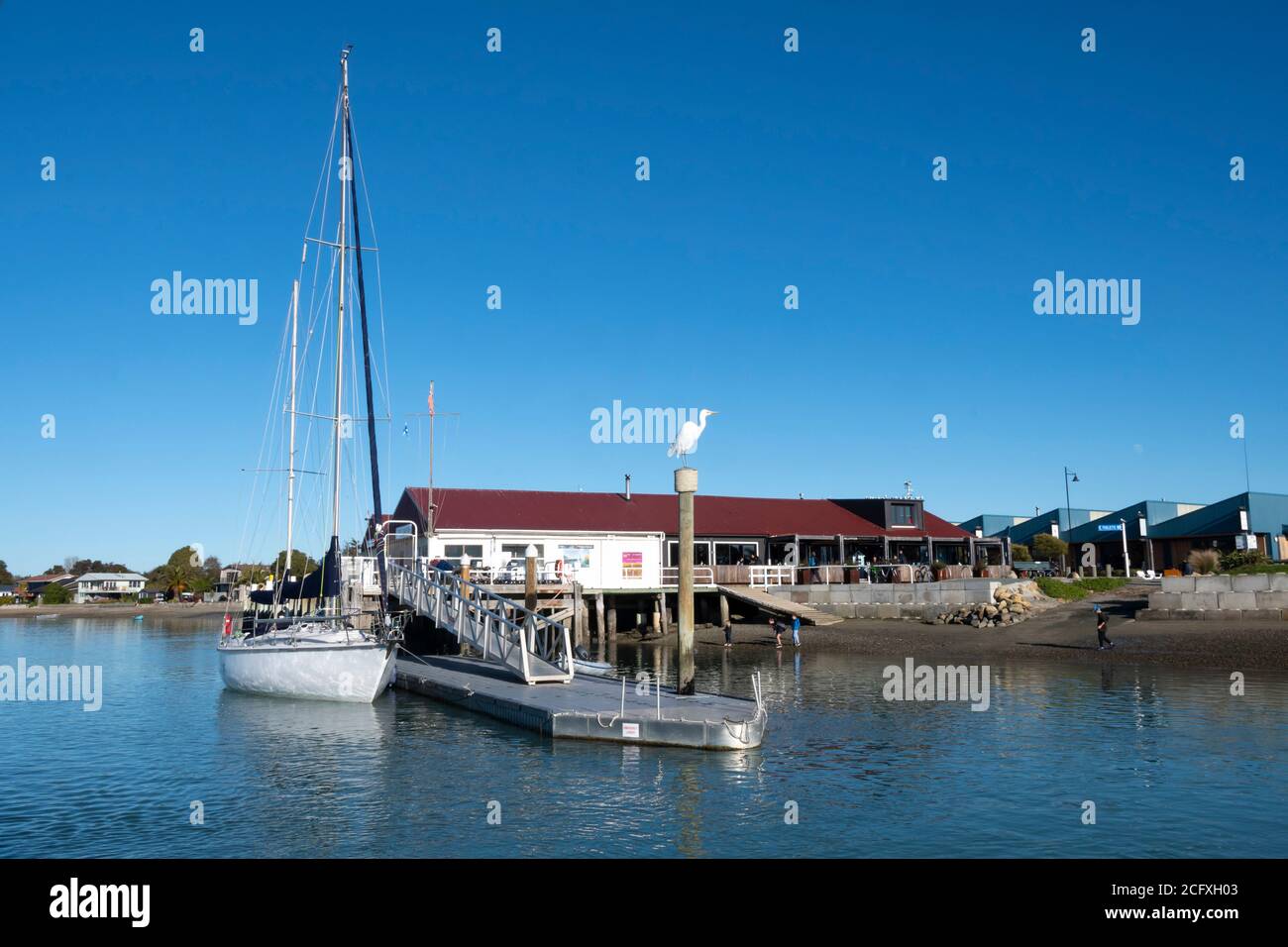 Boats and wharf at Mapua, Nelson, South Island, New Zealand Stock Photo ...
