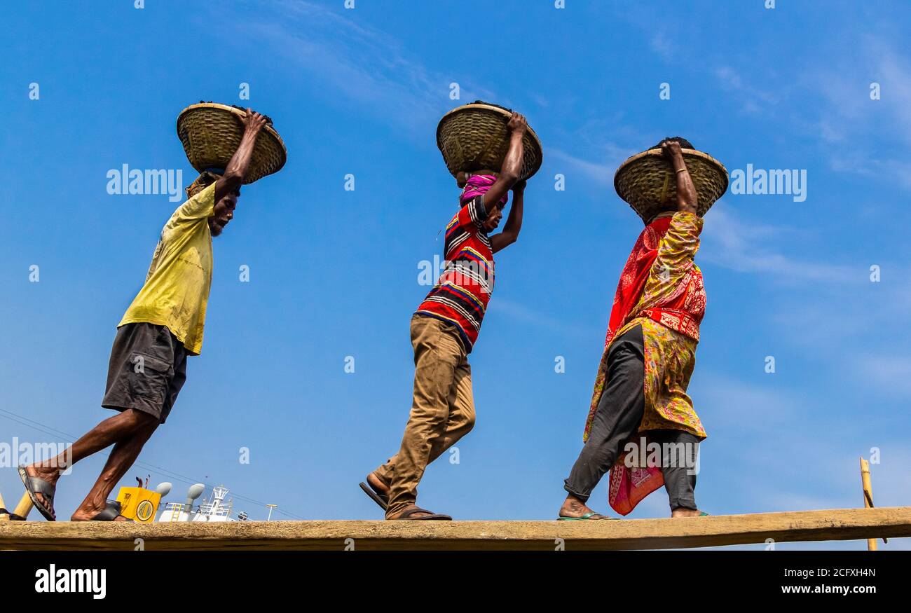 Work hard poor man carrying hi-res stock photography and images - Alamy