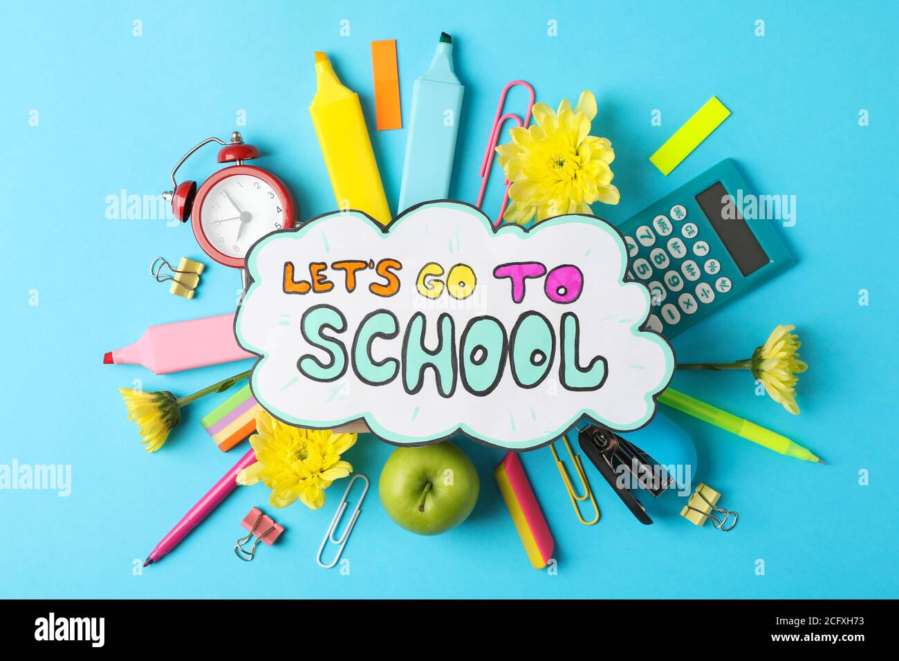 Text Let's go to school and school supplies on blue background Stock ...