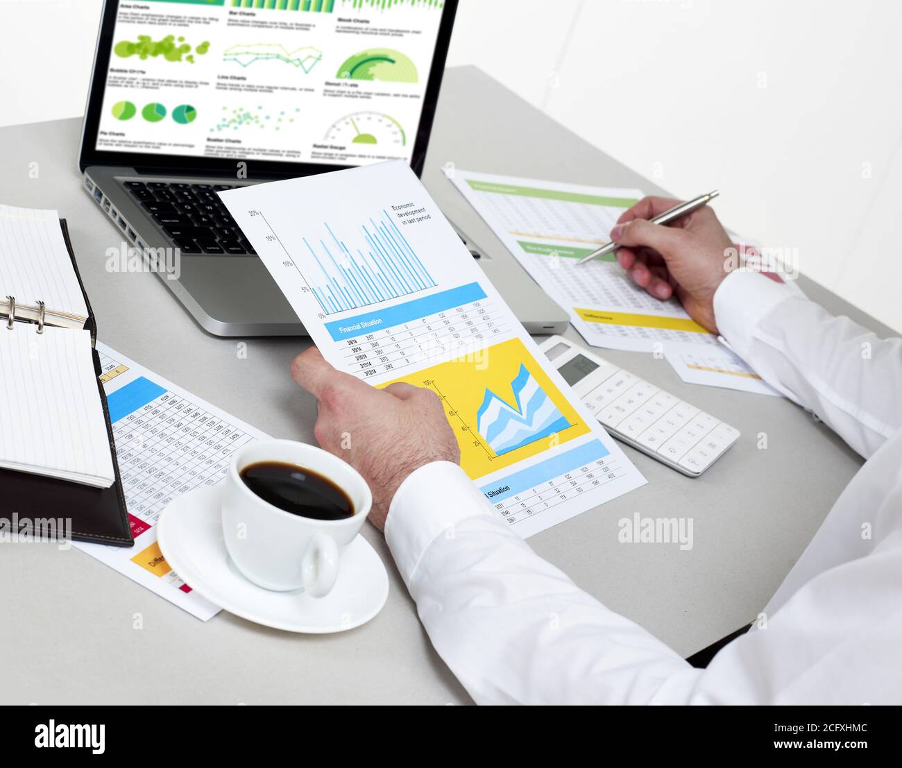Business man working on financial issues Stock Photo - Alamy