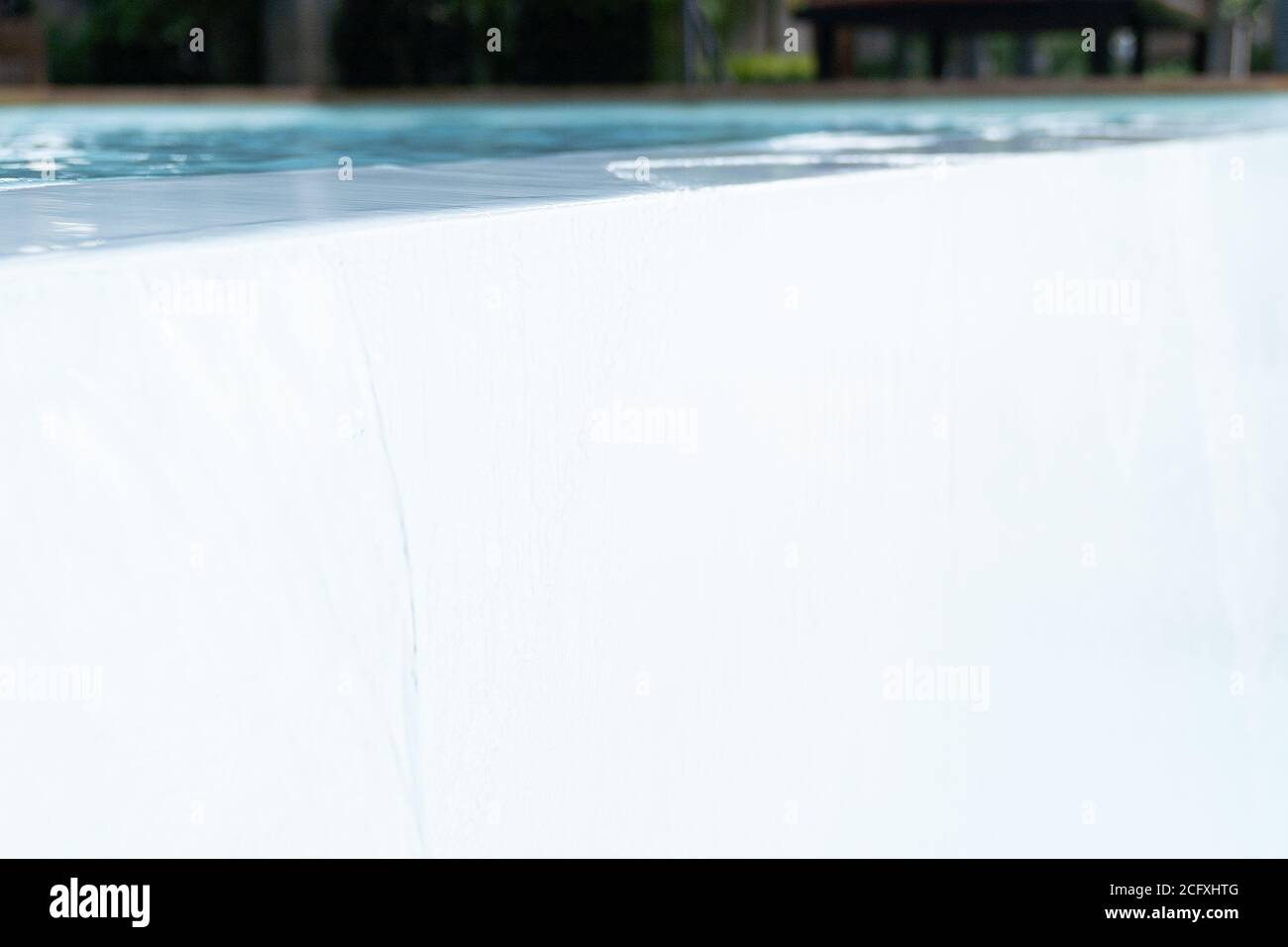 Close up. Swimming pool with teak wood flooring stripes summer vacation ...