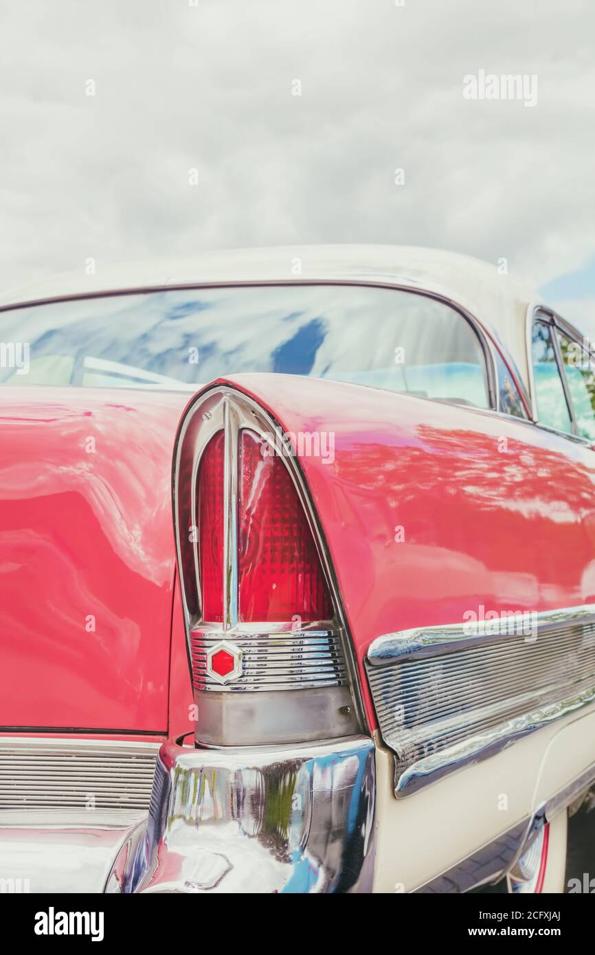 Retro styled image of the rear end of a pink classic car Stock Photo ...