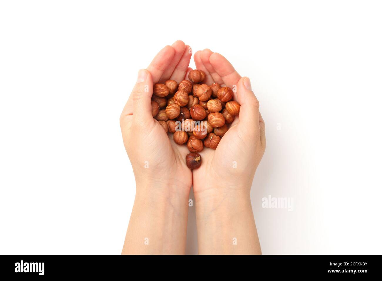 Female hands holds hazelnuts, isolated on white background Stock Photo ...