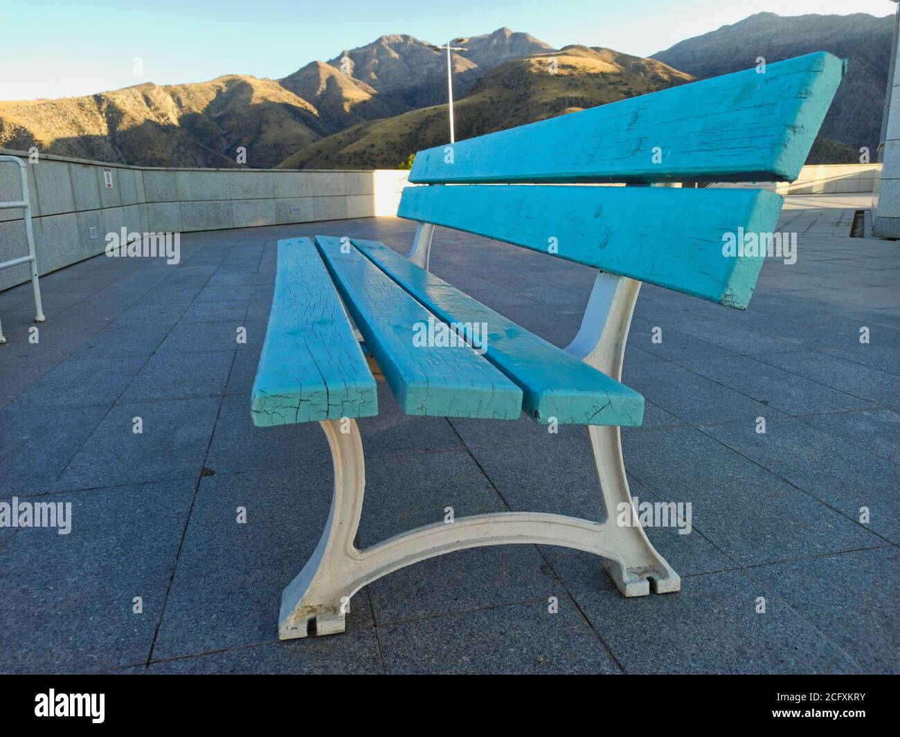 blue Park bench in summer at sunset Stock Photo - Alamy