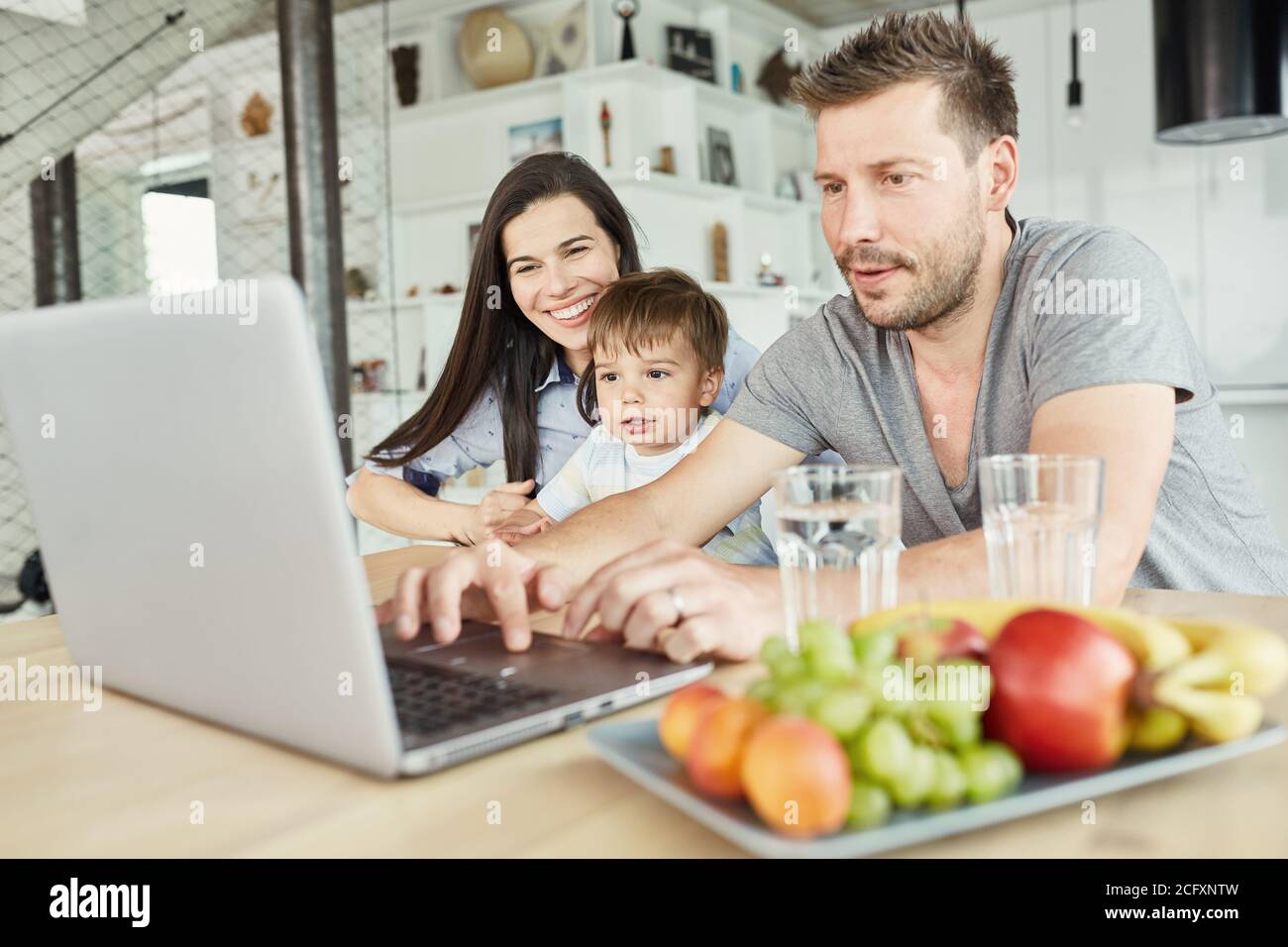 Family and child on laptop computer in social media or video chat Stock ...