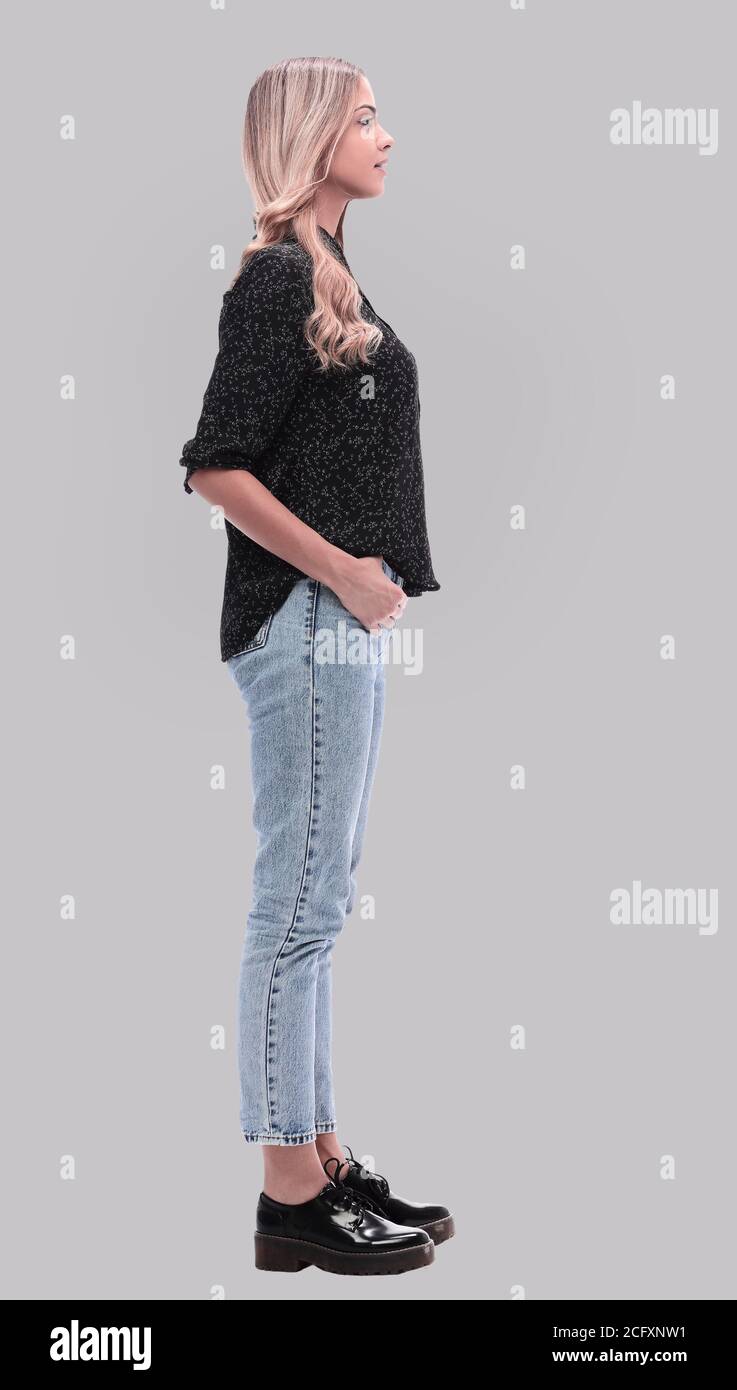 side view. modern young woman in jeans and black blouse Stock Photo - Alamy