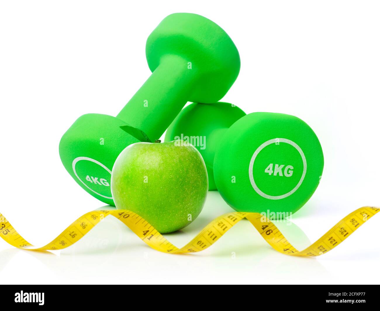 Apple, tape measure and dumbbells isolated on white Stock Photo - Alamy