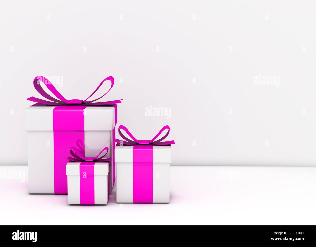 Gift boxes and empty white wall Stock Photo - Alamy