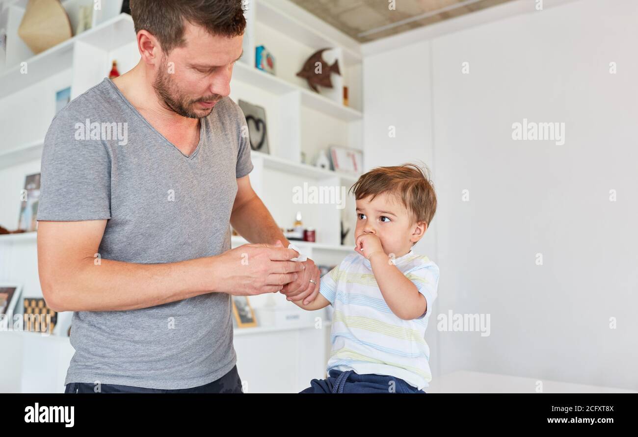 Father lovingly takes care of his son for responsibility and care Stock ...