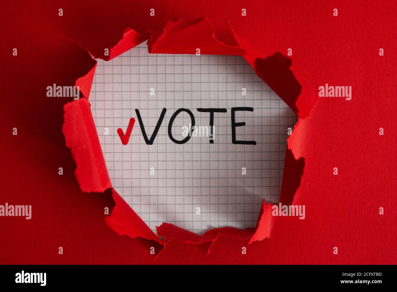 Red background with hole against squared paper with text Vote Stock ...