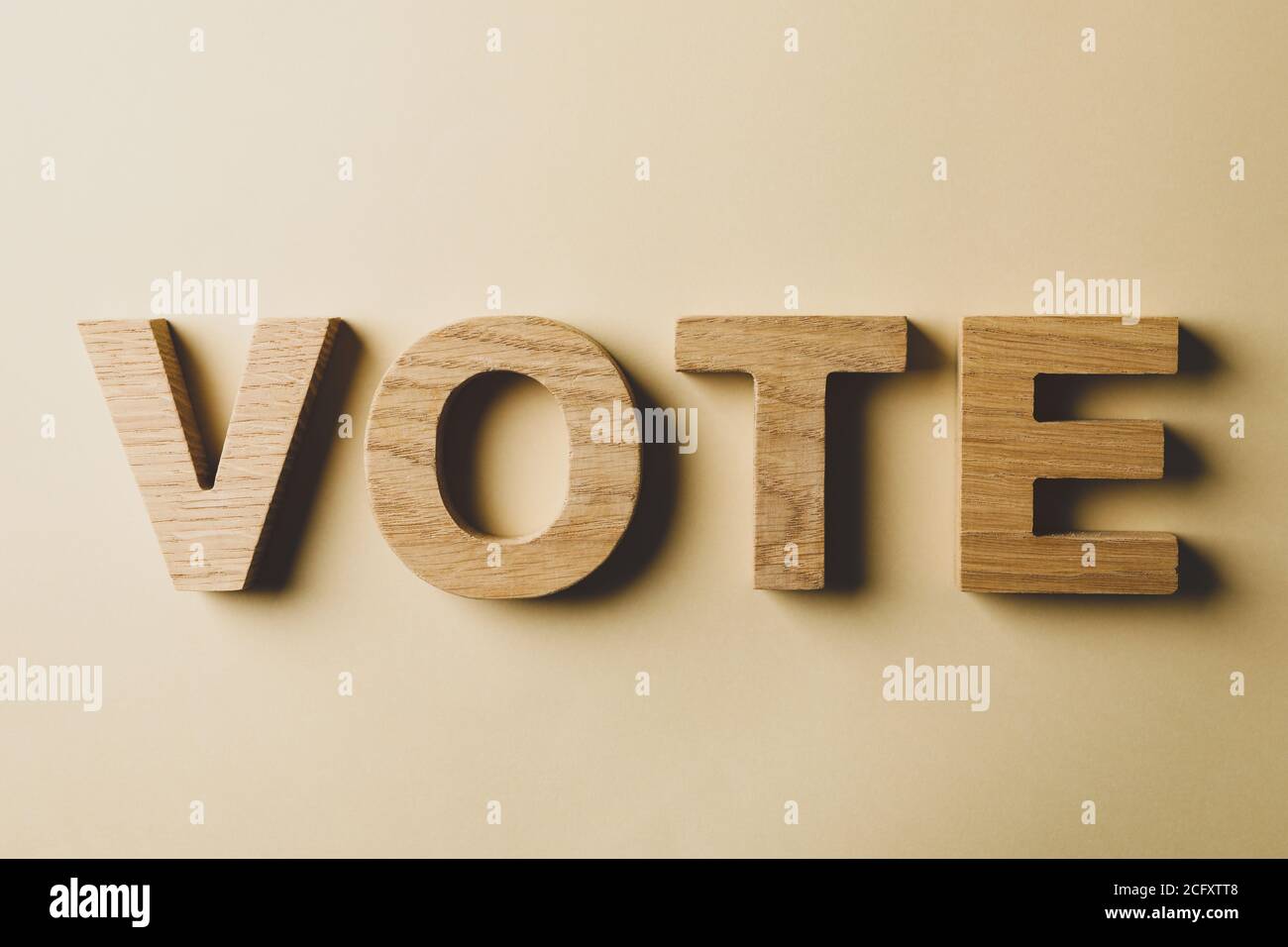 Word Vote made of wooden letters on beige background Stock Photo - Alamy