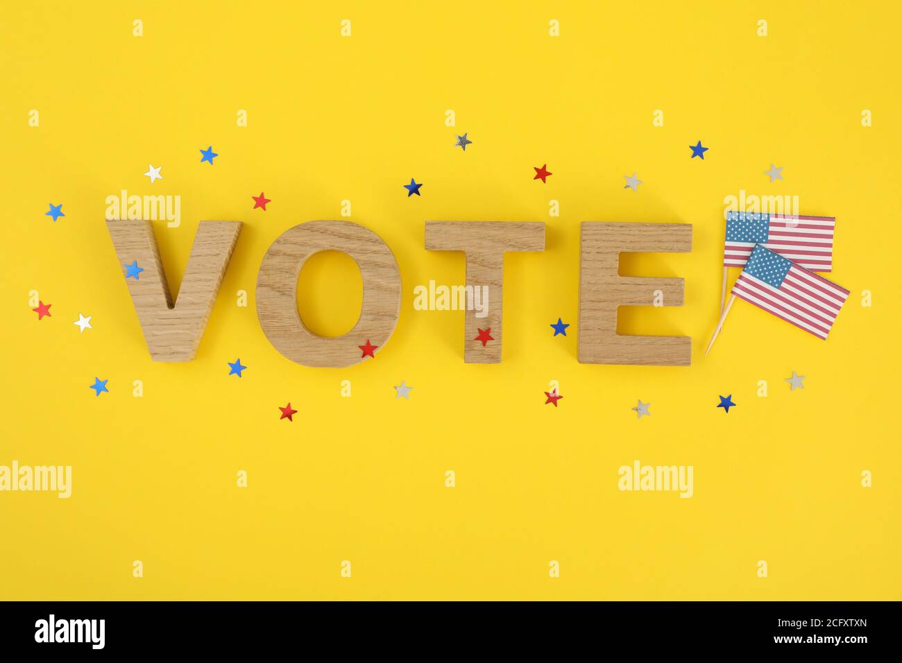 American flags, word Vote and stars on yellow background Stock Photo ...
