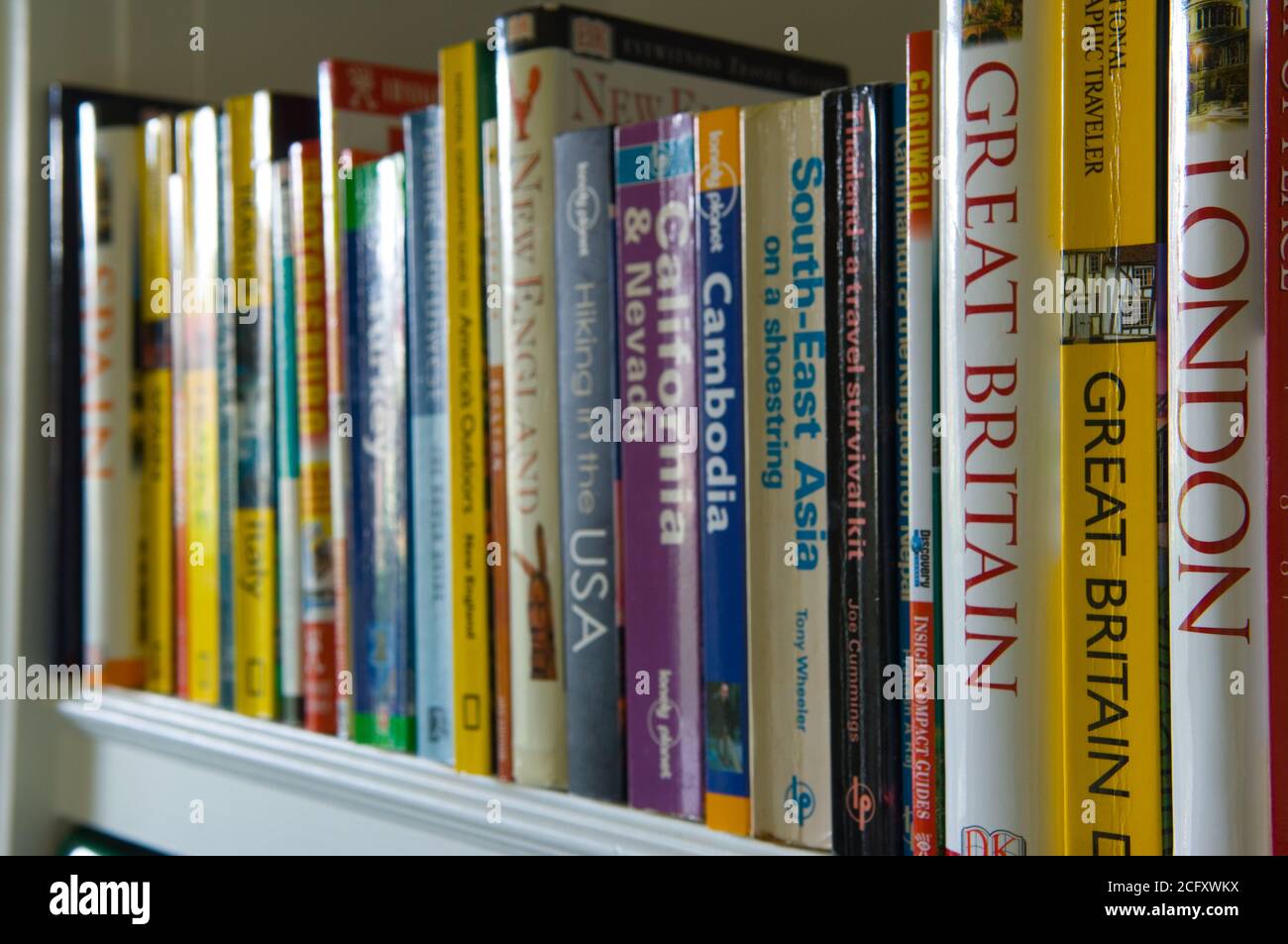 Travel Books on a bookshelf Stock Photo - Alamy
