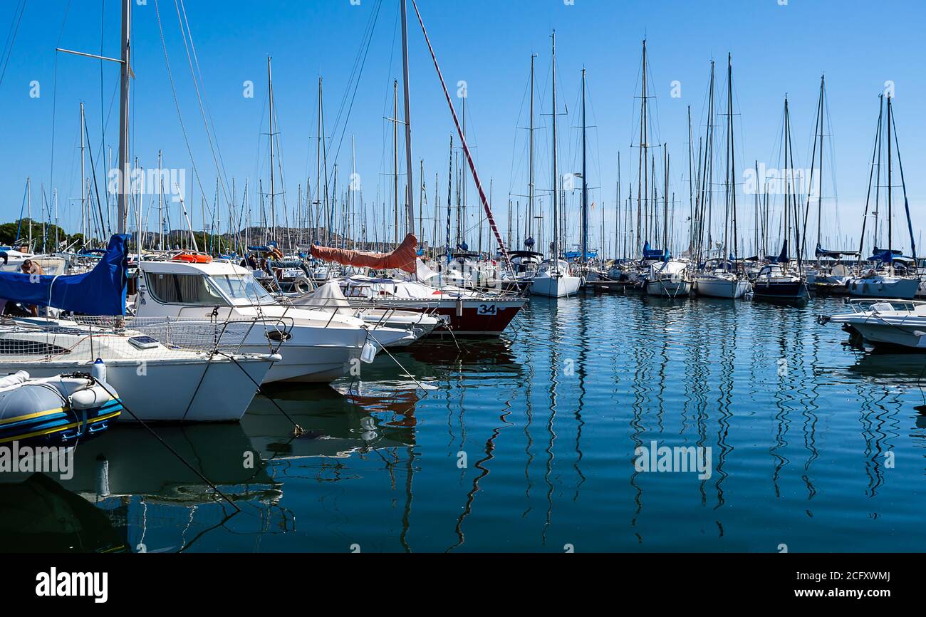boats moored in a pier mediterranean sea dock Stock Photo - Alamy