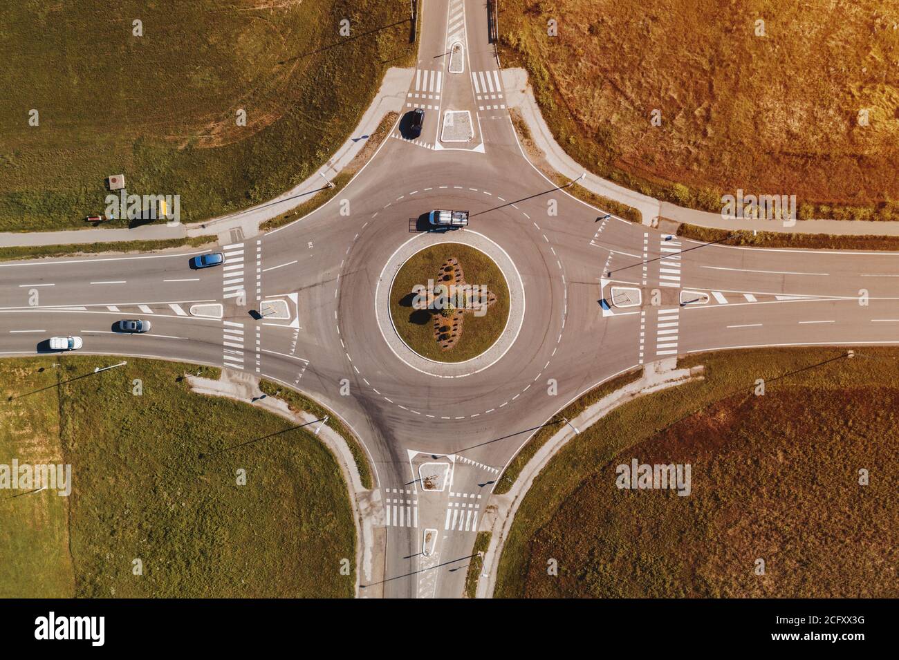 Cars on road circular intersection roundabout, top view drone pov Stock ...