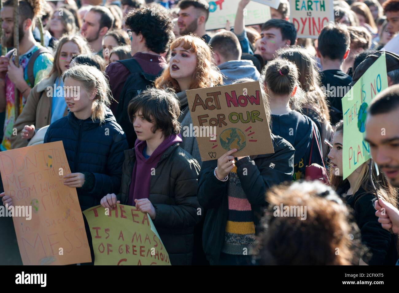 Signs at the school climate strike where youths protested about the ...