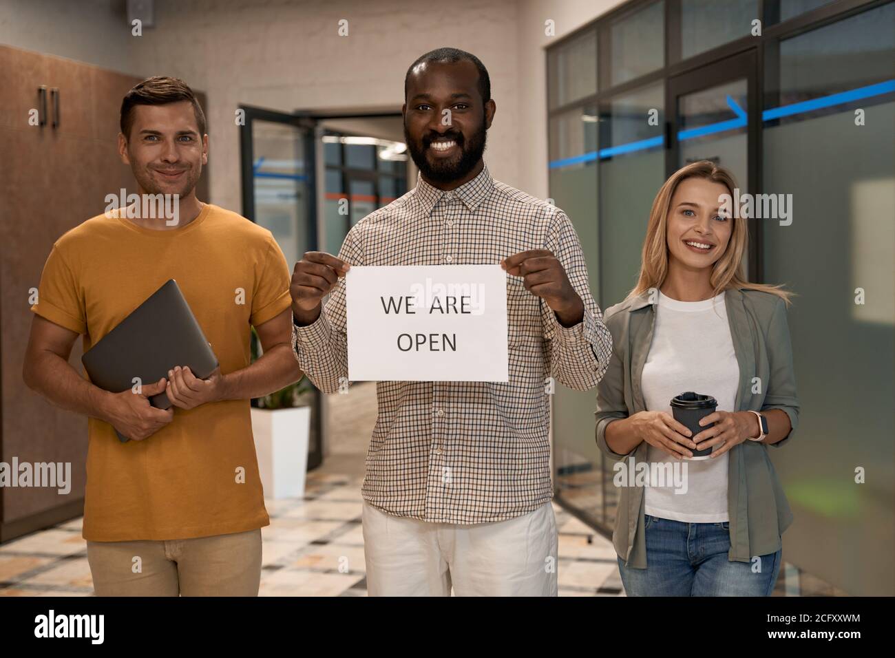 Happy african office worker hi-res stock photography and images - Alamy
