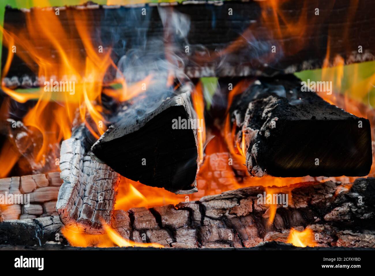 Burning wood in a barbecue grill. Open flames. Cooking outdoors Stock ...