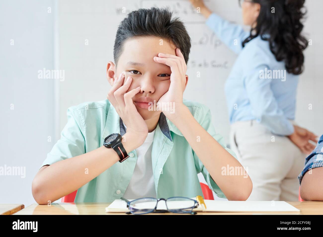 Boy studying table girl talking hi-res stock photography and images - Alamy
