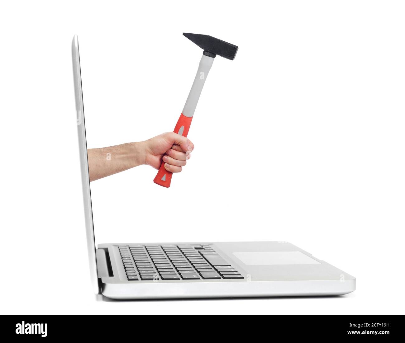 Hand with hammer out of laptop Stock Photo - Alamy