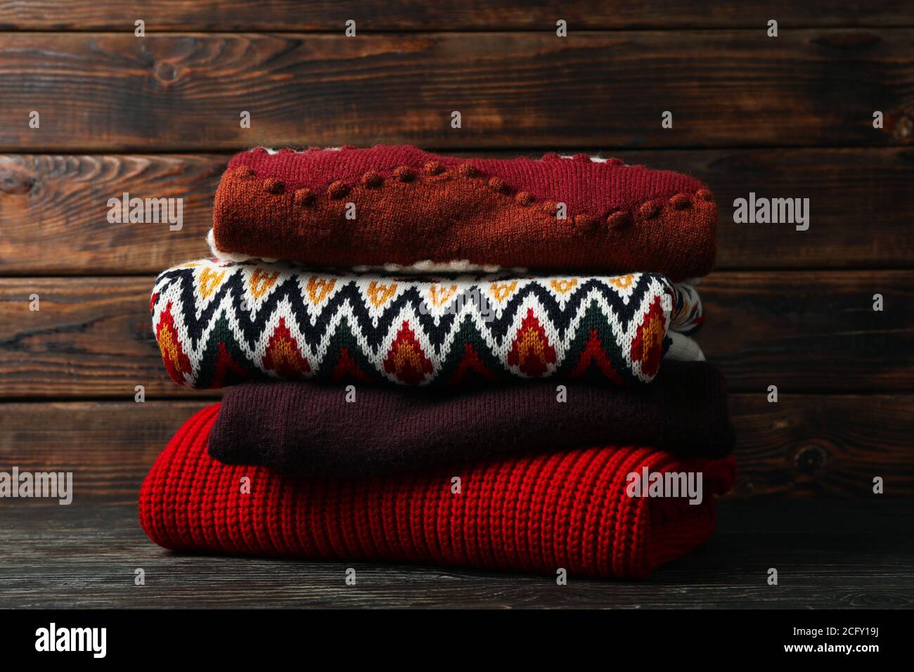Stack different cozy sweaters hi-res stock photography and images - Alamy