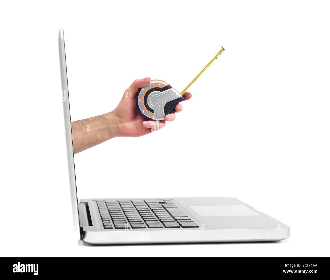 Hand with tape measure out of laptop Stock Photo - Alamy