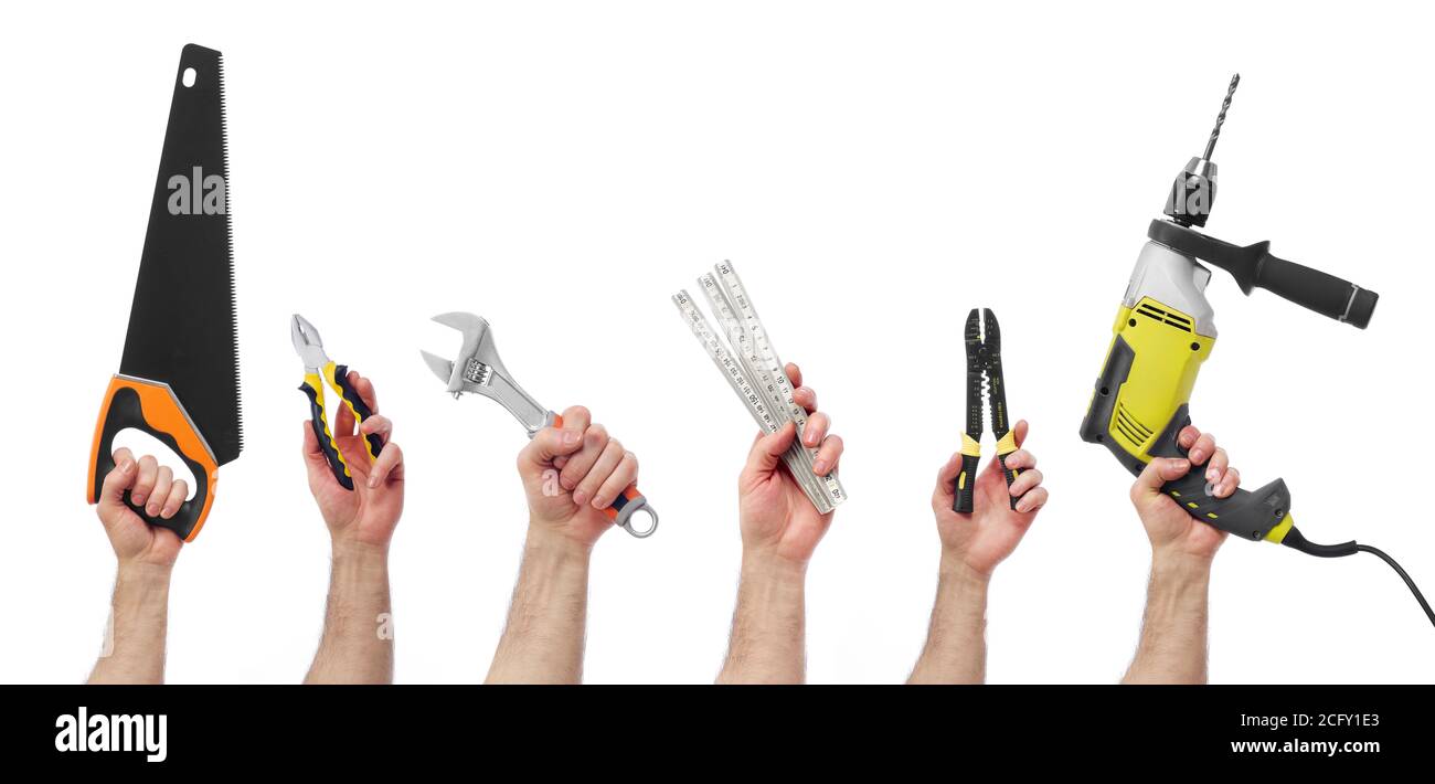 Hands raised holding different tools Stock Photo - Alamy